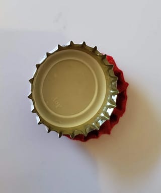 Stitched Cross Stitch Ornament using a Bottle Cap | Thread Bare